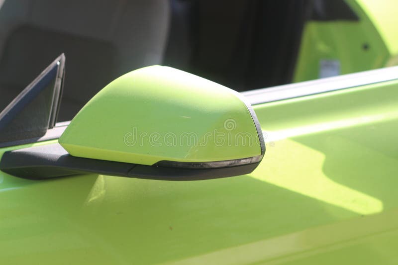 Side mirror on a green car stock image. Image of rearview - 317368853