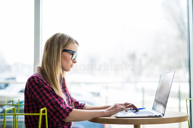 Side Portrait Young Woman Worker Sitting in Office while Using Laptop ...
