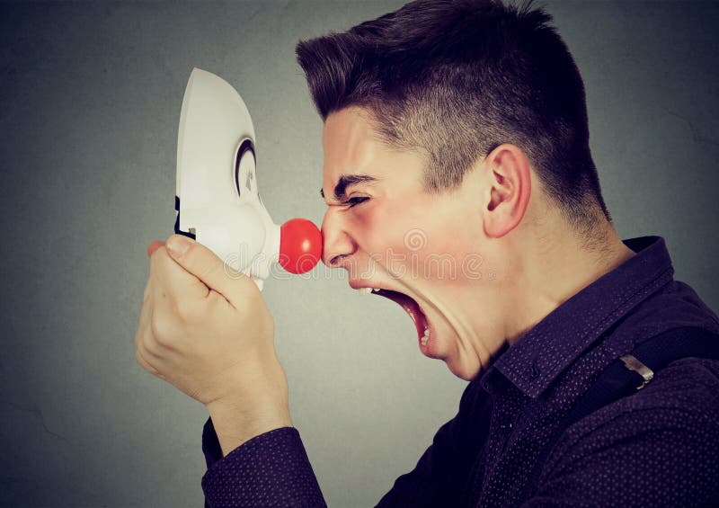 Side Profile Angry Man Screaming at Happy Clown Mask Stock Image ...