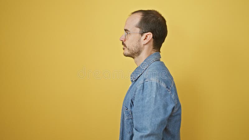 Side-profile of a Bearded, Bald Hispanic Man in Denim Isolated Against ...