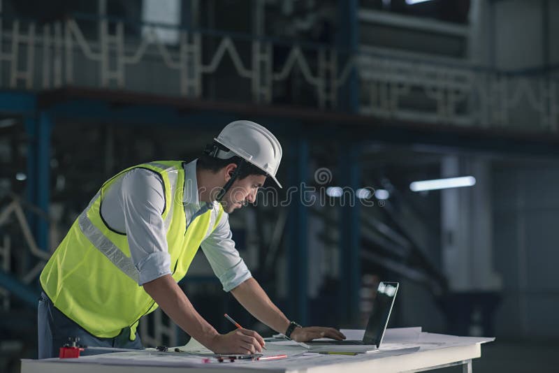 Side Profile of a Male Architect Working in the Construction Site of a ...