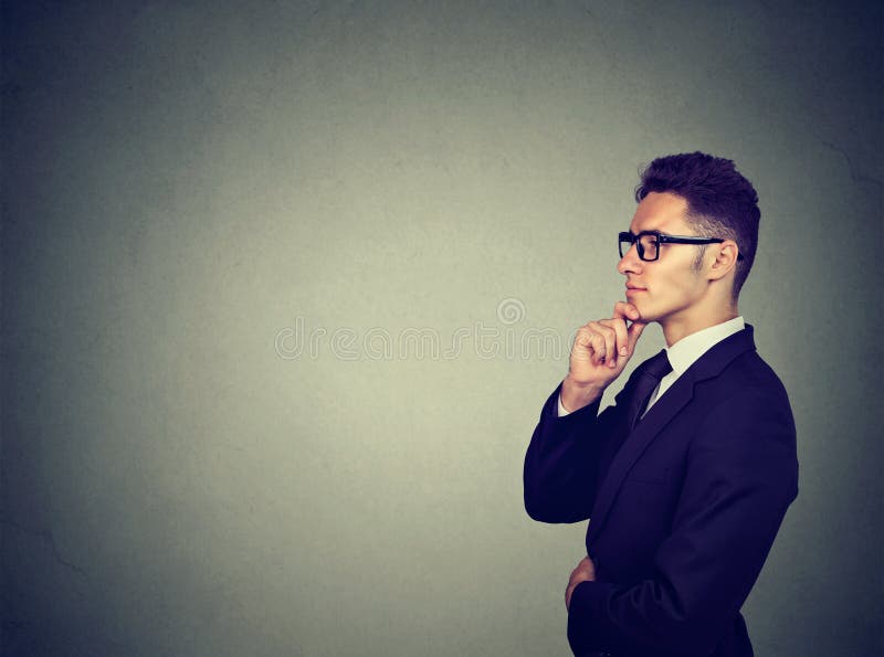Side Profile of a Thinking Young Man with Hand on Chin Looking Up Stock ...