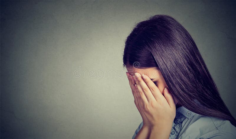 Side Profile of a Sad Woman Covering Her Face with Hands Stock Photo ...
