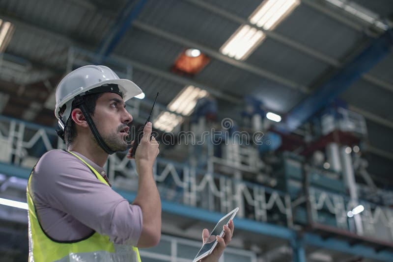 Side Profile of a Technical Engineer Talking on Walkie Talkie in the ...
