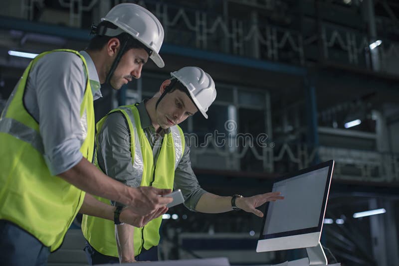Side Profile of Two Male Technical Engineers Working on Digital Tablet ...
