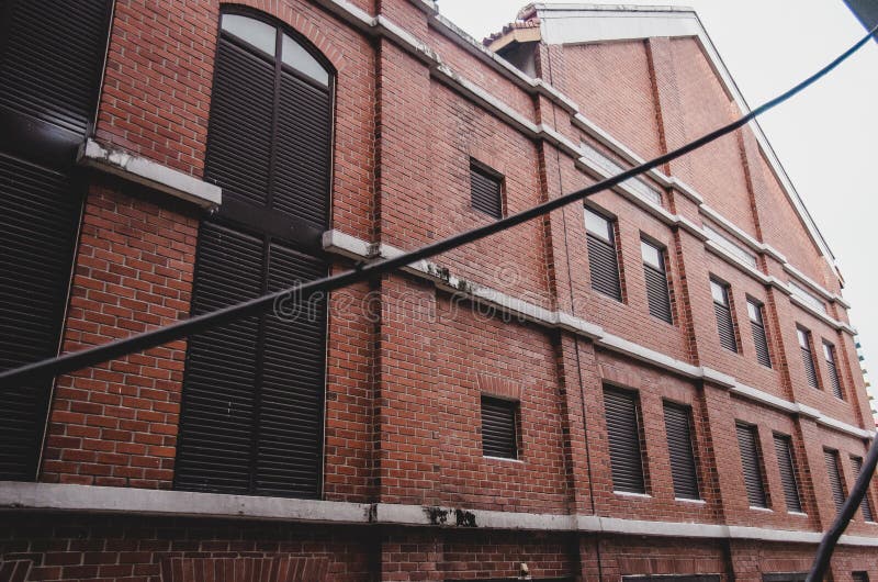 The Side of a Red Bricked Building Stock Image - Image of houses ...
