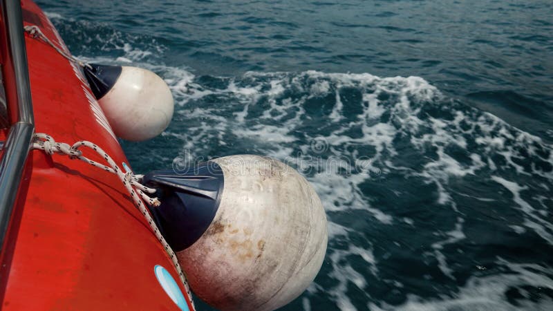 Side of the Red Life Saving Rescue Boat Sailing in Cold Ocean Waves ...