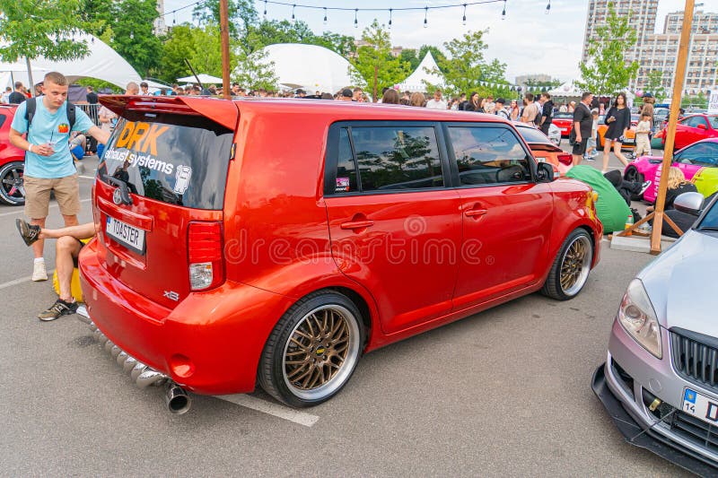 A Side-by-side Composite Image Featuring a Bright Red Compact Car with ...
