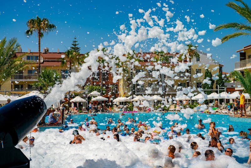 Foam party in the pool. editorial photo. Image of bubbles - 341744496