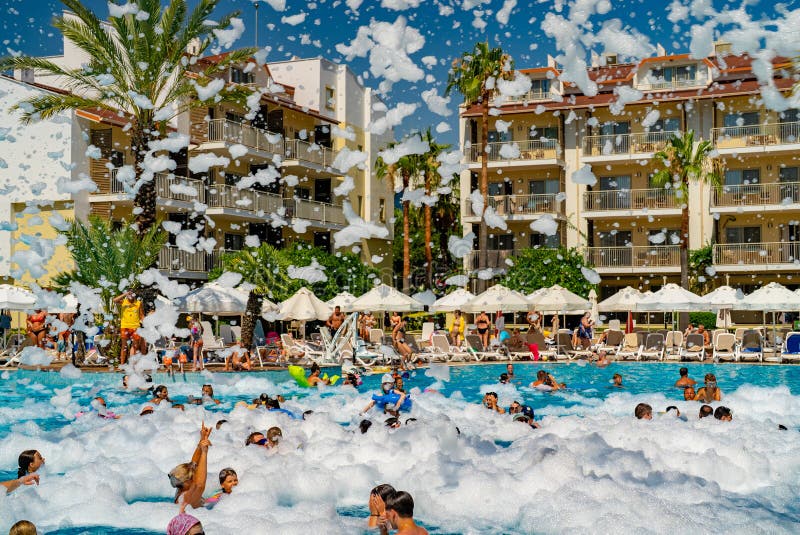 Foam party in the pool. editorial stock image. Image of happy - 341744504