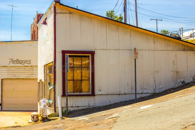 Side View of Abandoned Antique Store with Boarded Up Windows Stock ...