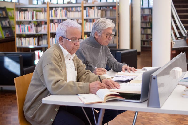 Side View of Aged Men Actively Studying Stock Image - Image of ...