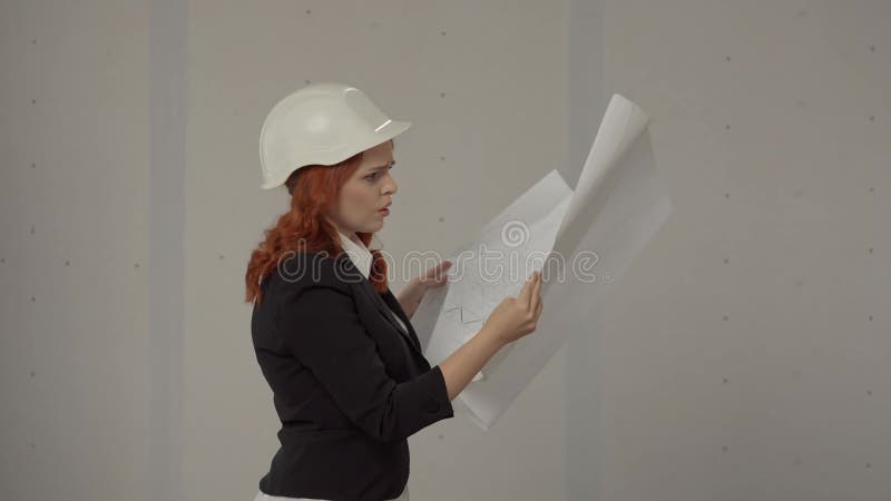Side View of an Architect Woman Holding a Plan, Drawing of a Building ...