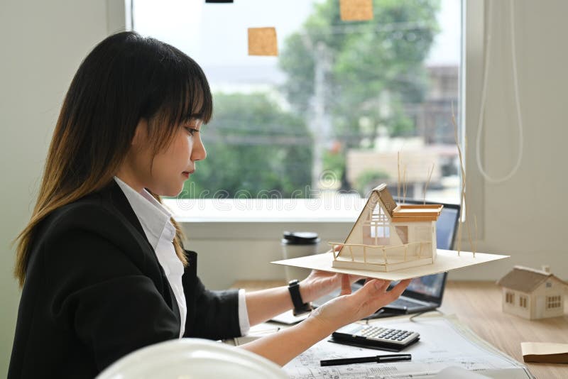 Side View of Architects Woman Working on Design of a Construction Plan ...