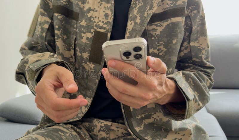 Side View of Army Soldier Text Messaging Against White Background Stock ...