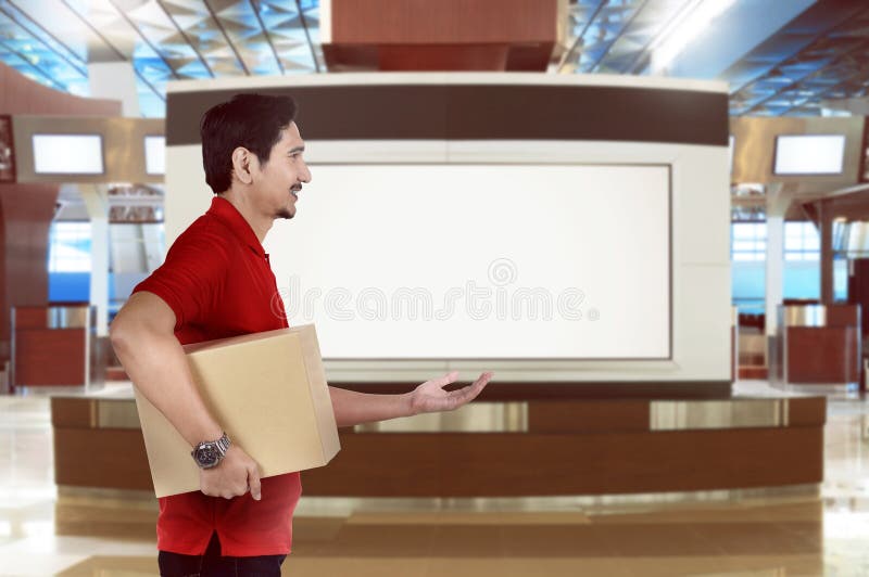 Side View of Asian Delivery Man Send a Parcel Stock Image - Image of ...