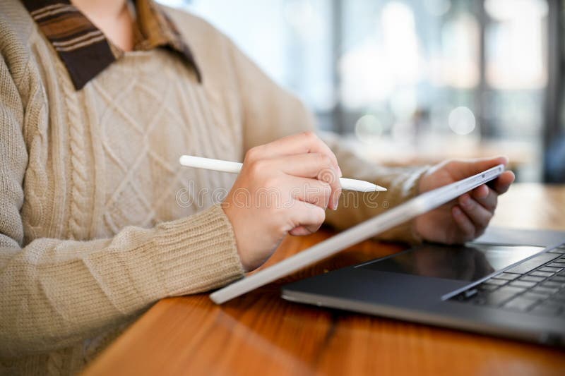 Side View, Asian Female Using Her Digital Tablet at Her Desk, in Front ...