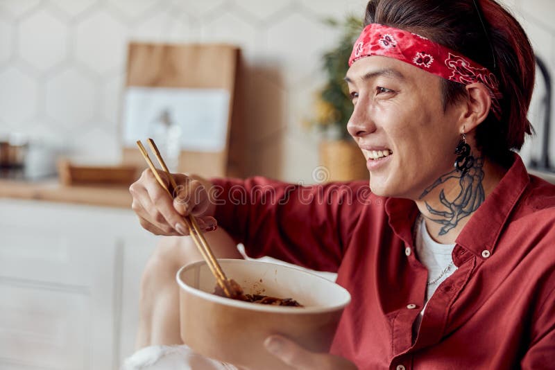 Happy Young Man Eating Noodles and Using Chopsticks Stock Image - Image ...