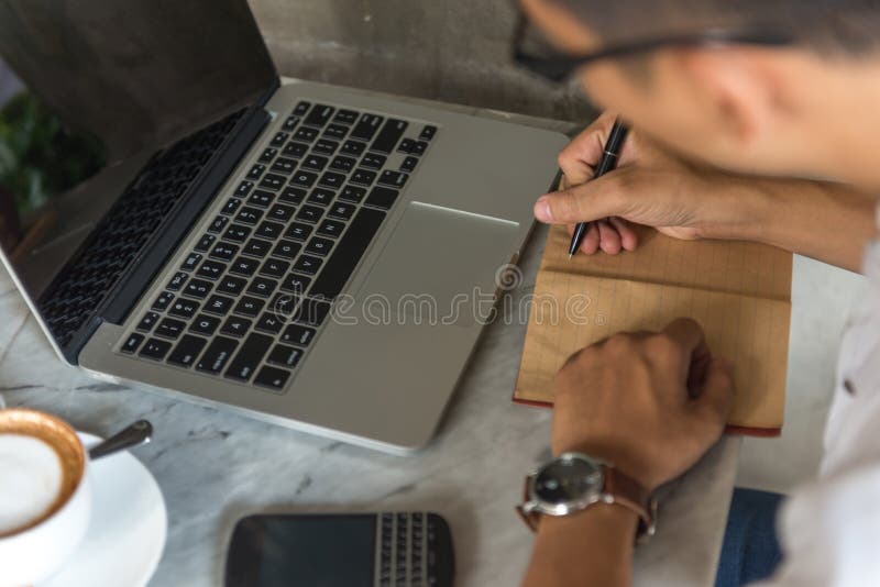Side View of Asian Man Writing into Notes Stock Image - Image of note ...