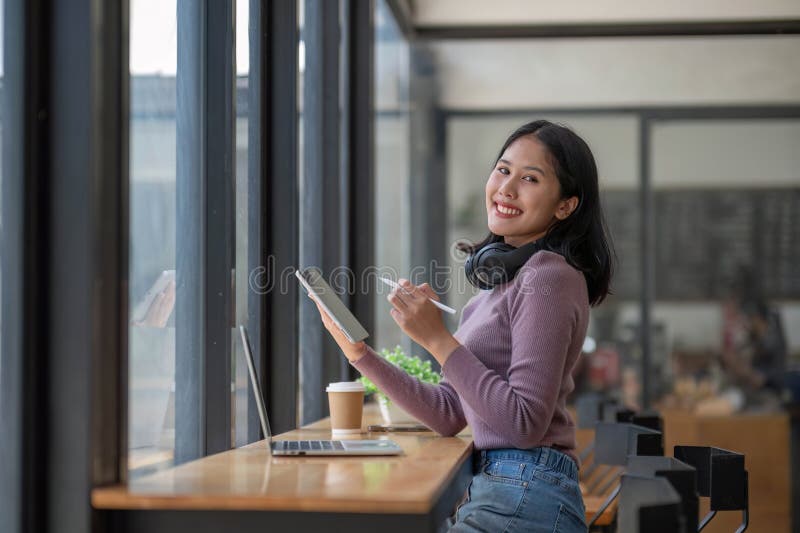 Side View of an Attractive and Smiling Young Female Freelancer Remote ...