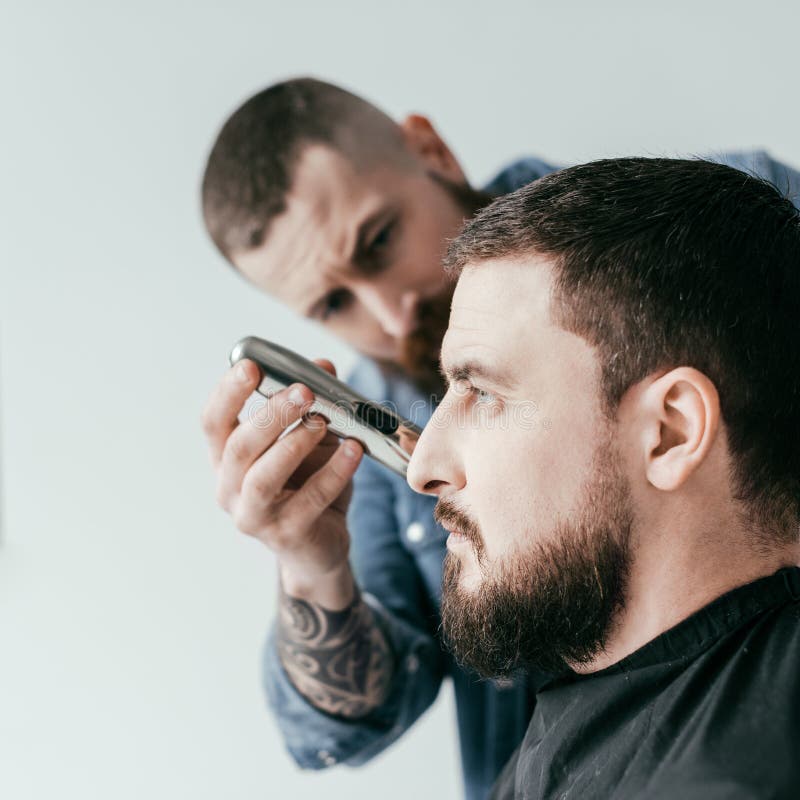 Side View of Barber Trimming Customer Beard at Barbershop Stock Image ...
