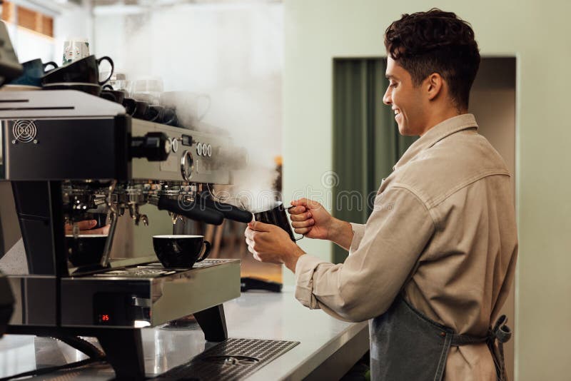 Side View of a Barista Using a Coffee Machine. Coffee Shop Owner ...