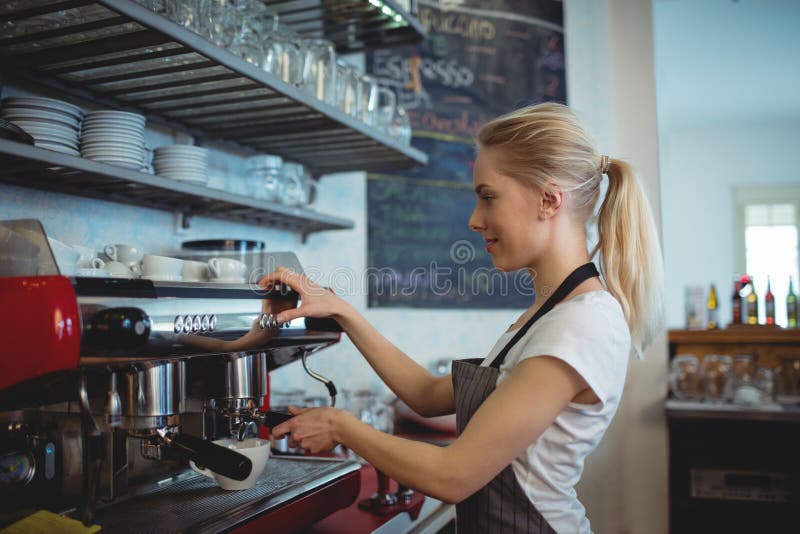 Side View of Barista Using Espresso Maker at Coffee House Stock Image ...