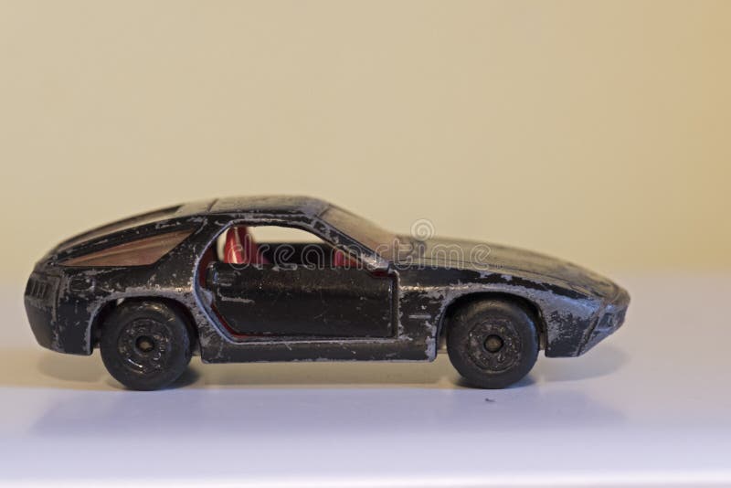 A battered black toy car stock photo. Image of crashed - 106919794