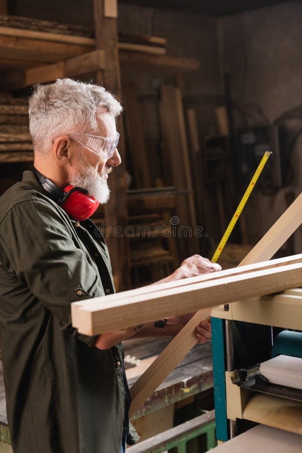 Side View of Bearded Woodworker Measuring Stock Photo - Image of ...