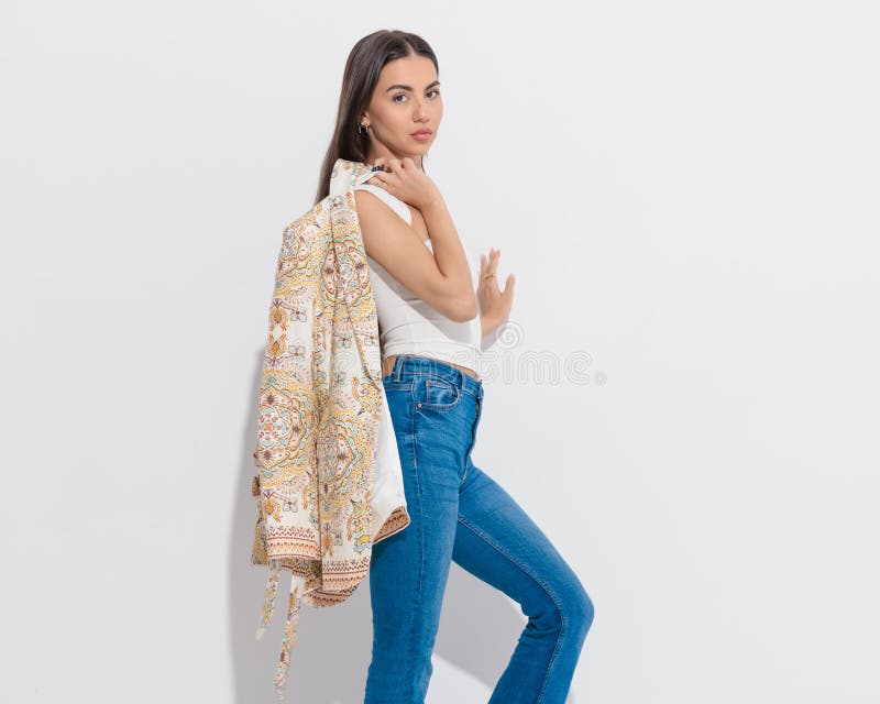 Side View of Beautiful Smart Casual Girl with Jacket on Shoulder Posing ...
