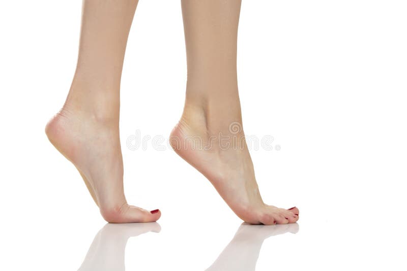 Side View of a Beautifully Cared Female Feet on a White Background ...