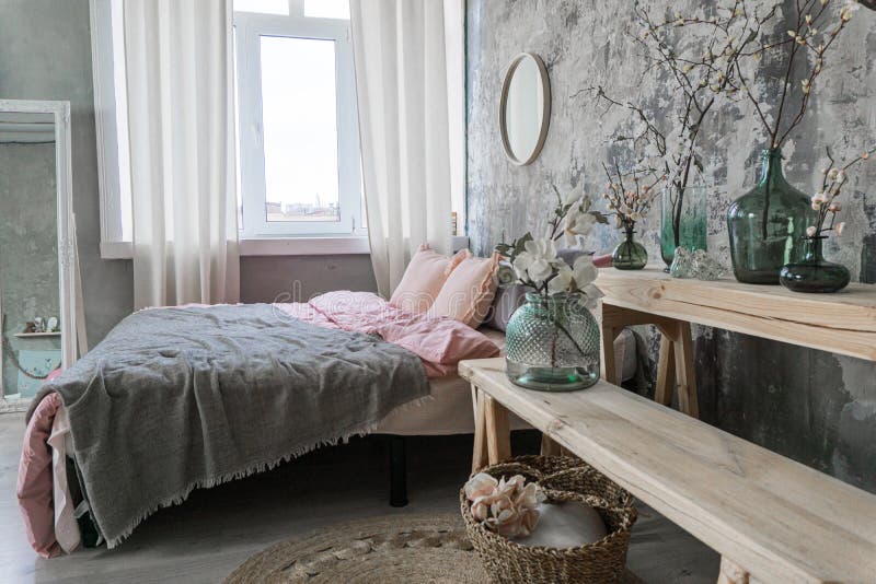 Side View on a Bed with Grey and Pink Bedding and Fvases with the ...