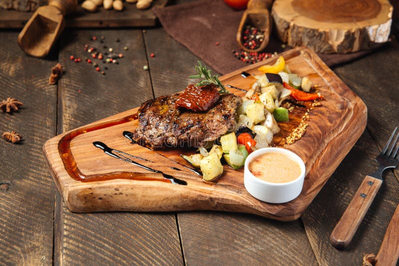 Beef Steak with Vegetables on the Wooden Board Stock Image - Image of ...