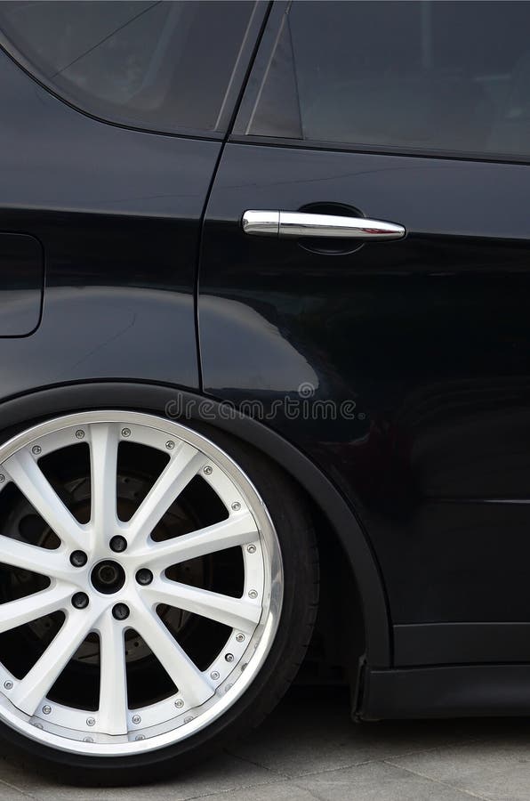 Side View of a Black Glossy Car with White Wheels Stock Image - Image ...