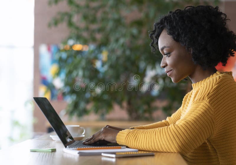 Side View of Black Lady Typing on Laptop in Cafe Stock Photo - Image of ...