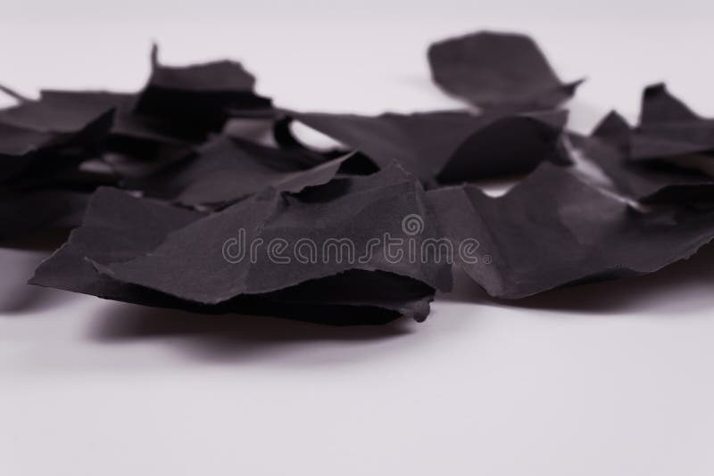 Side View of Black Scraps of Paper Close Up View Stock Photo - Image of ...