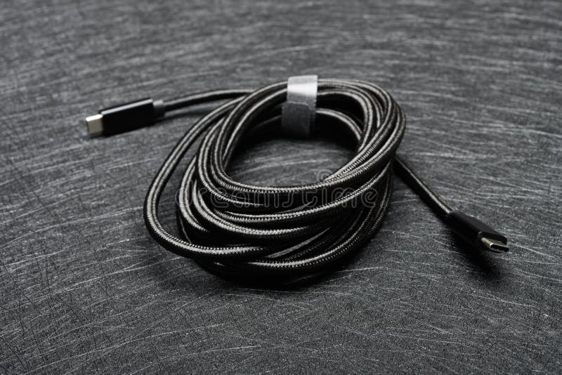 Two Black and Red Usb Type-c Connectors Next To a Lot of Modern Gadgets ...