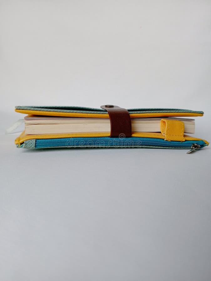 A Blue Diary with a Purse and Pen Hole Attached Stock Photo - Image of ...