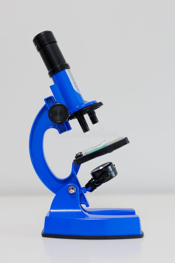 Side View of Blue Microscope on Table Stock Photo - Image of macro ...