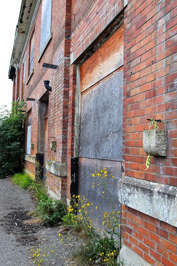 A Side View of a Boarded Up Brick Building Stock Photo - Image of rust ...