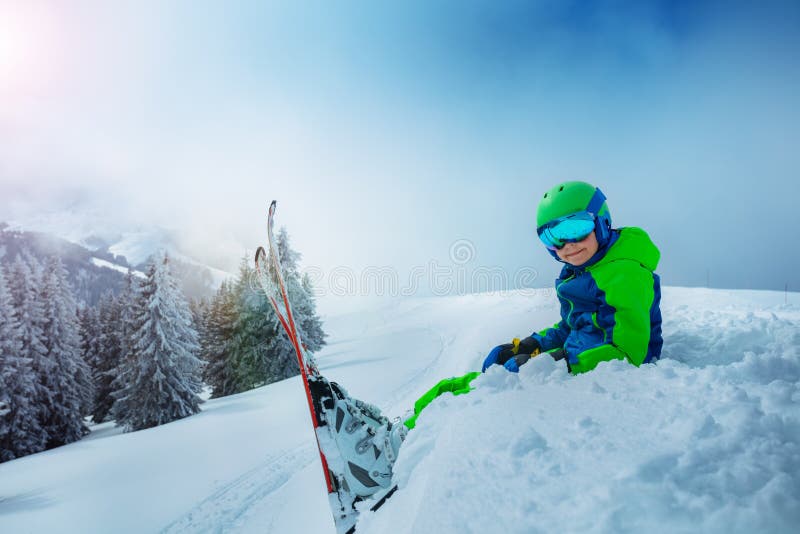 Side View of the Boy with Mountain Ski Sit in Snow Stock Image - Image ...
