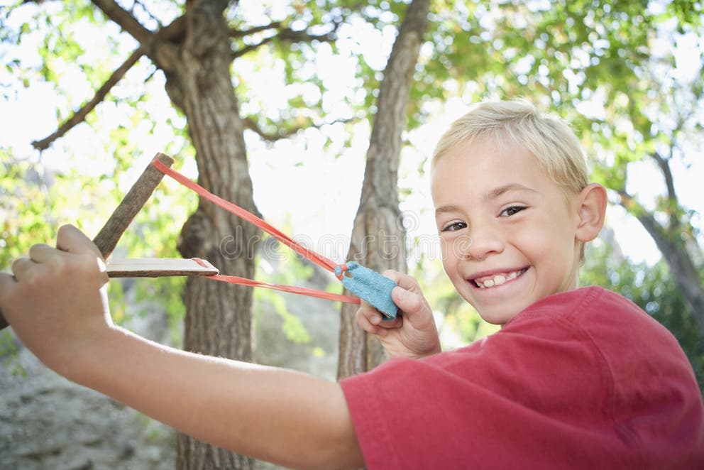 Side View of Boy Using Slingshot Stock Image - Image of horizontal ...