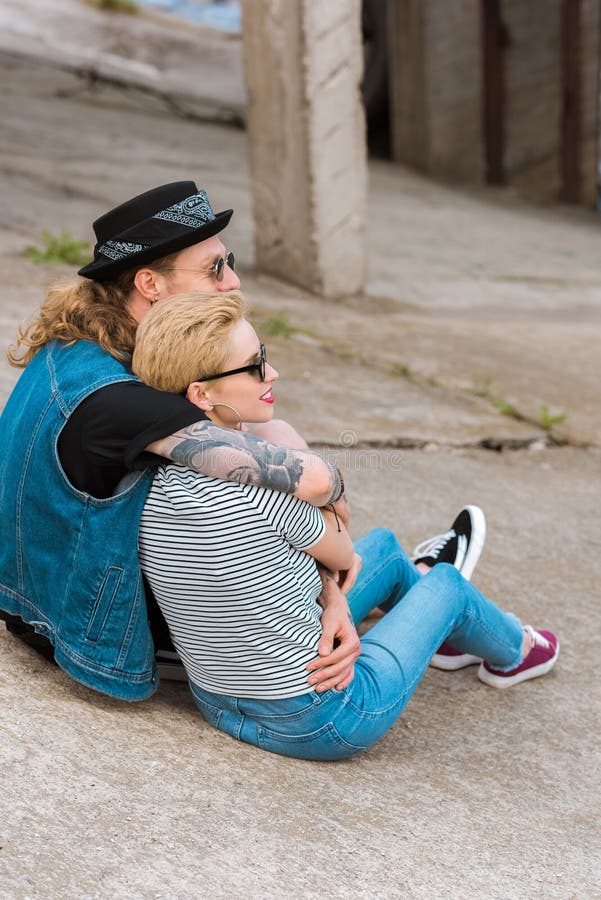 Side View of Boyfriend with Tattoos Hugging Stylish Girlfriend Stock ...