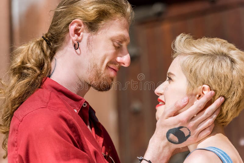 Side View of Boyfriend with Tattoos and Stylish Girlfriend Stock Photo ...
