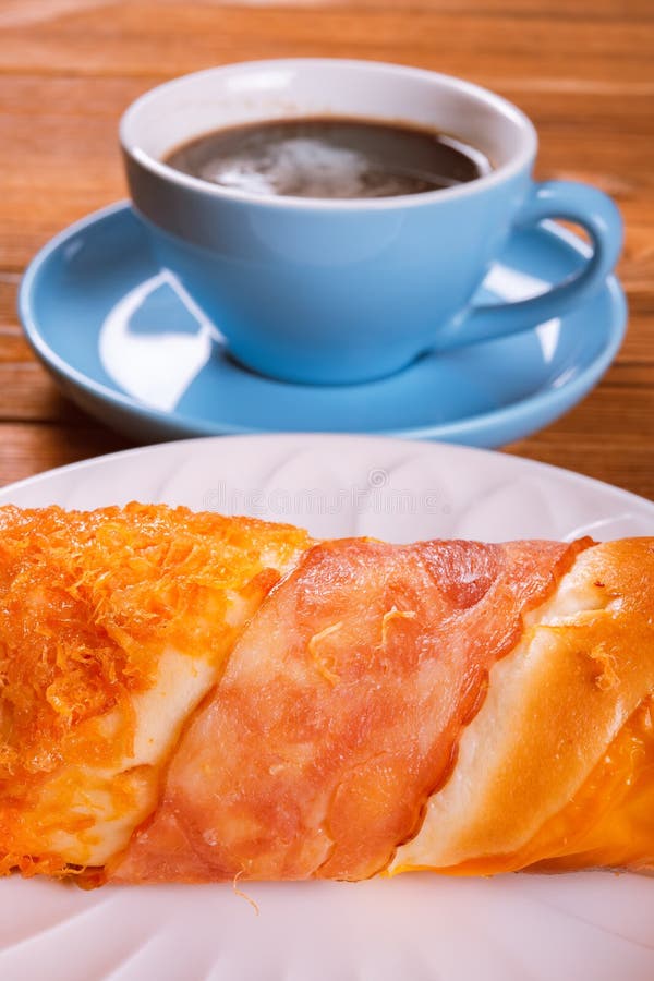 Bread with Bacon and Shredded Pork and Cup of Coffee on Back Stock ...