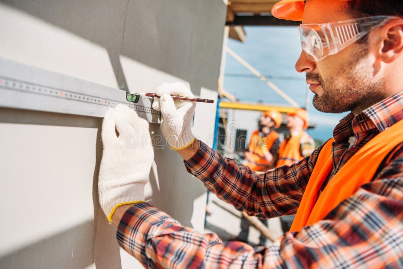 Side View of Builder Using Bubble Level Stock Image - Image of handsome ...