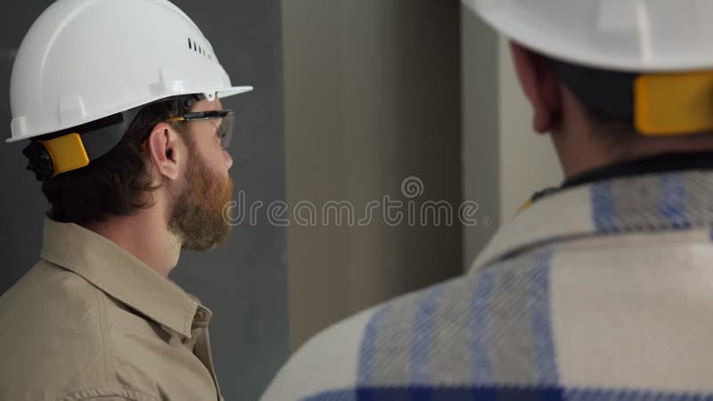 Side View of the Builders Who are Working on the Reconstruction of the ...