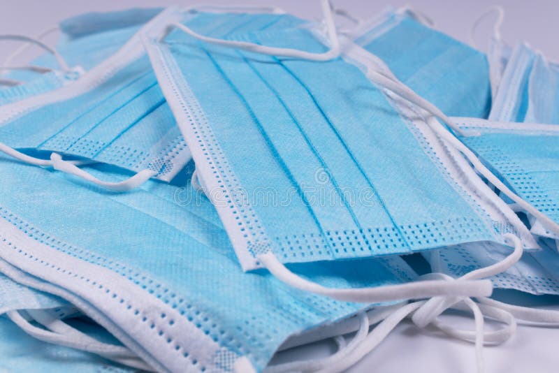 Side View of a Bunch of Blue Medical Masks Stock Photo - Image of covid ...