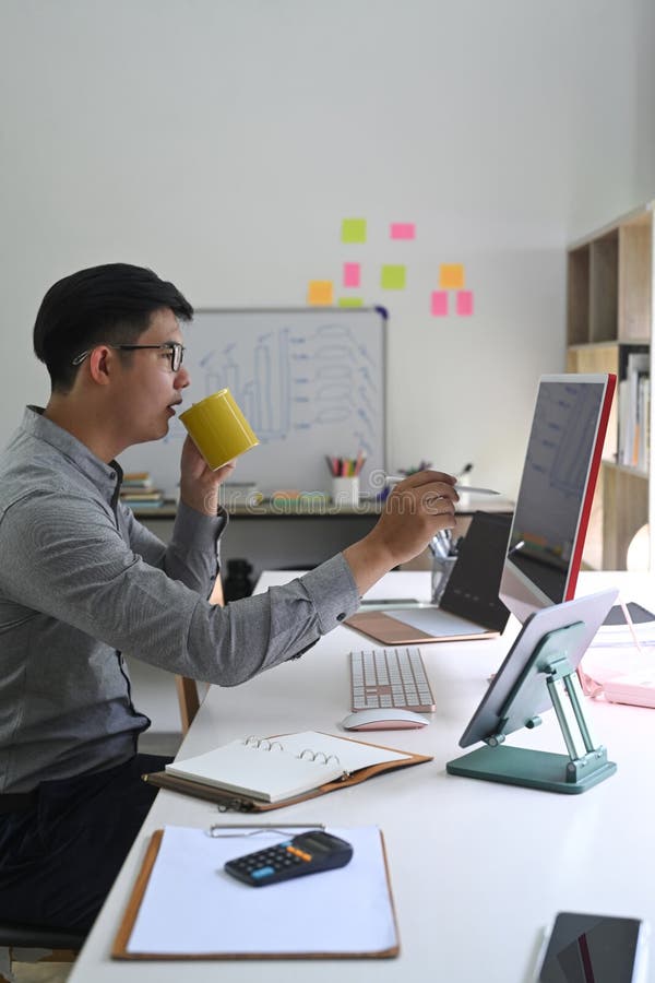 Businessman Drinking Coffee and Working with Computer. Stock Image ...