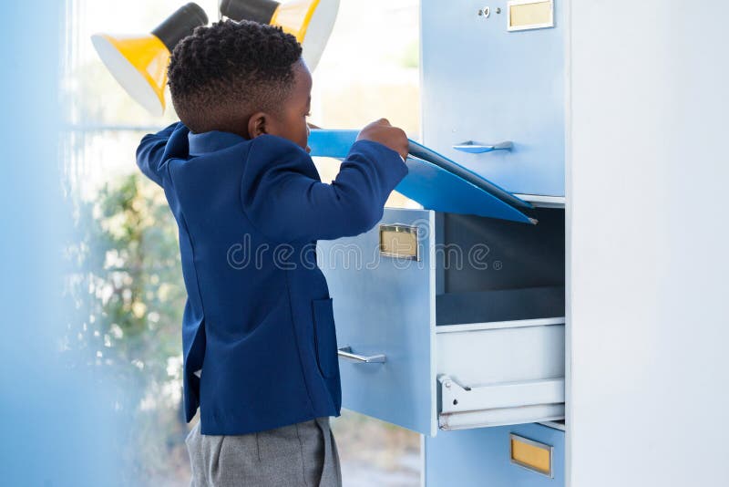 Side View of Businessman Keeping Files in Drawers Stock Image - Image ...